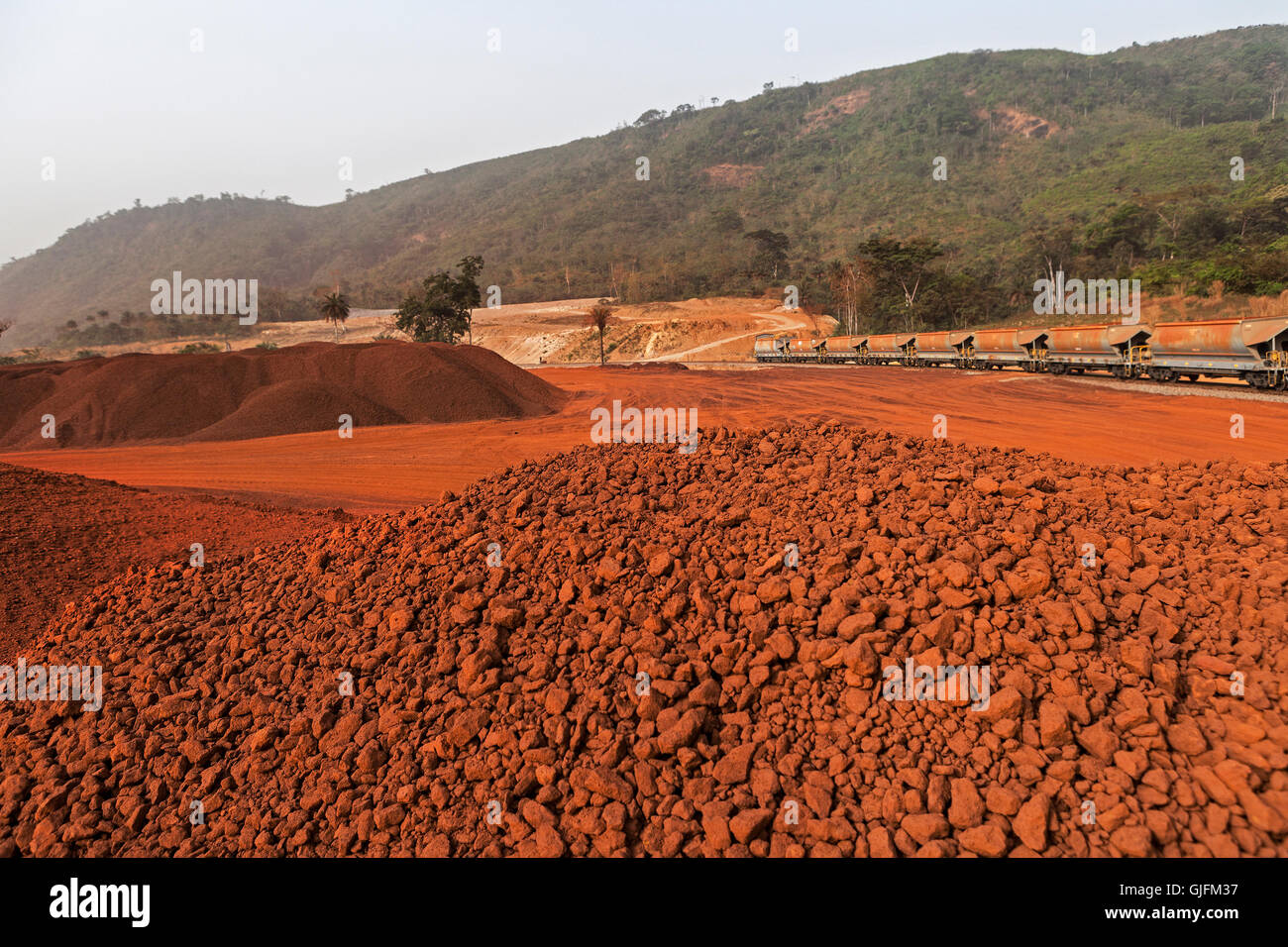 Rail head operations on iron ore mine. Wagons waiting to be loaded from ...