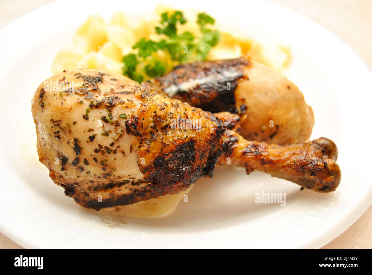 Close Up of Baked Chicken Legs Part of a Healthy Meal Stock Photo - Alamy