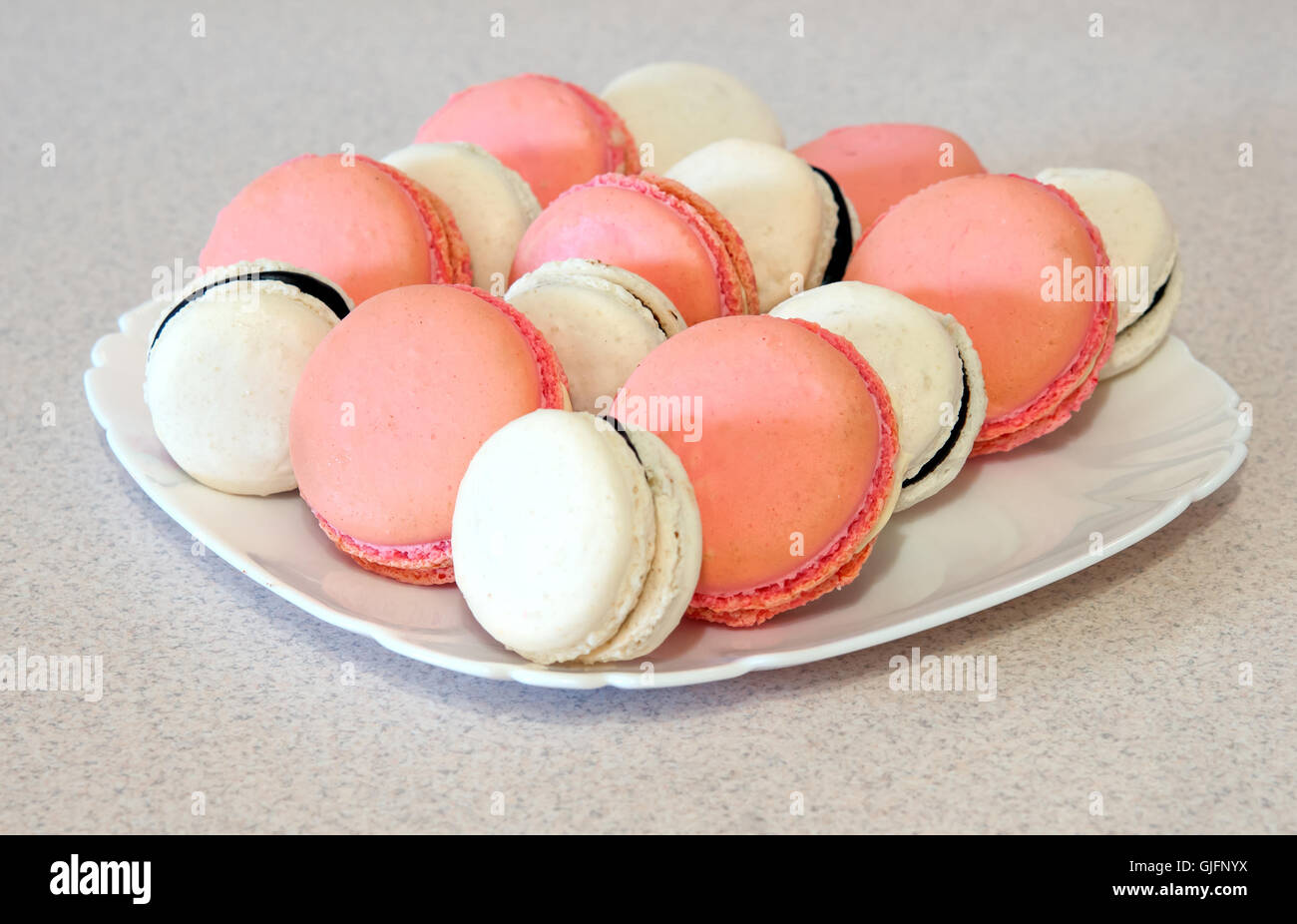 macaron in plate on wood table Stock Photo - Alamy