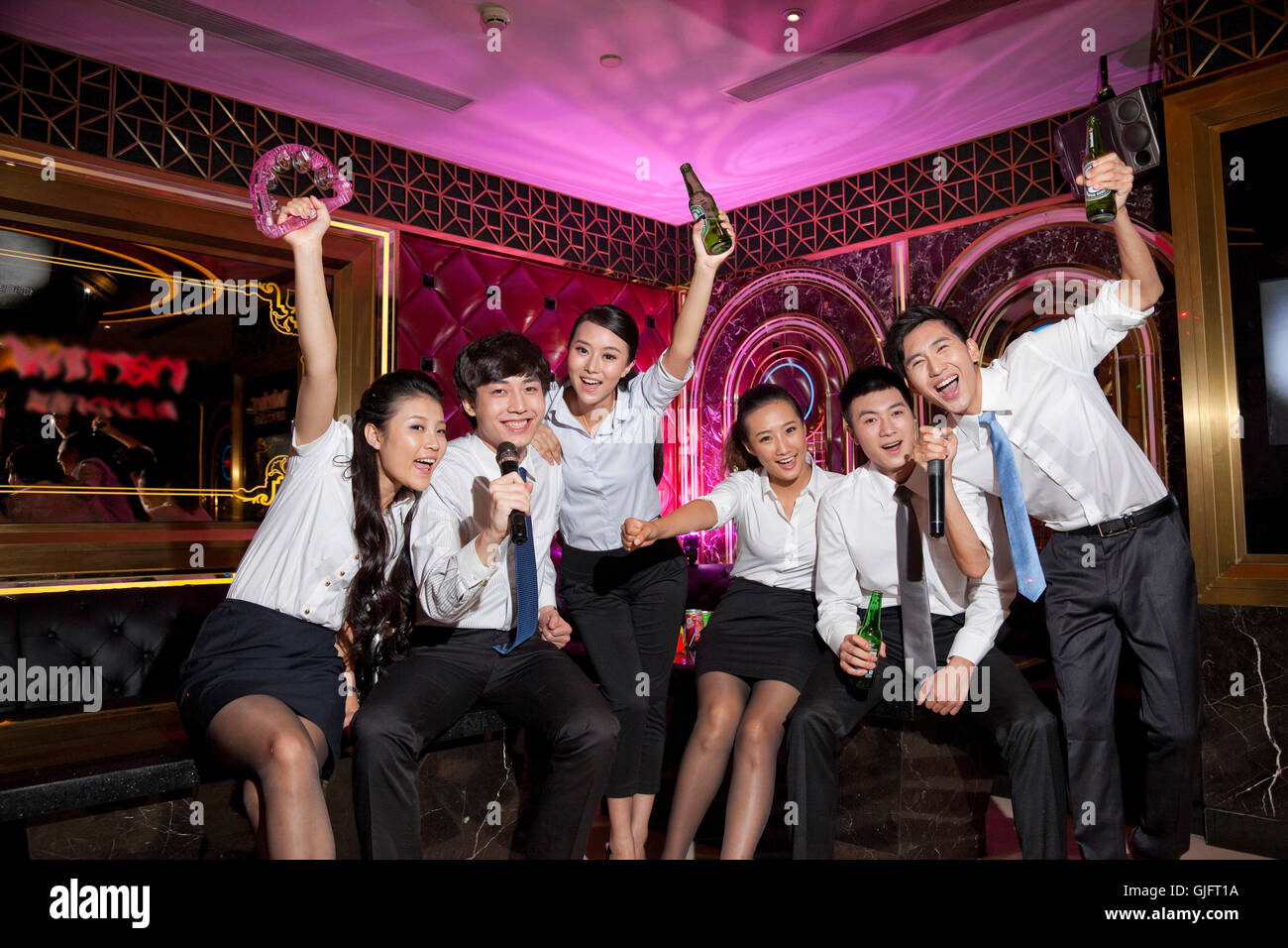 Group of young people gathering in KTV Stock Photo - Alamy