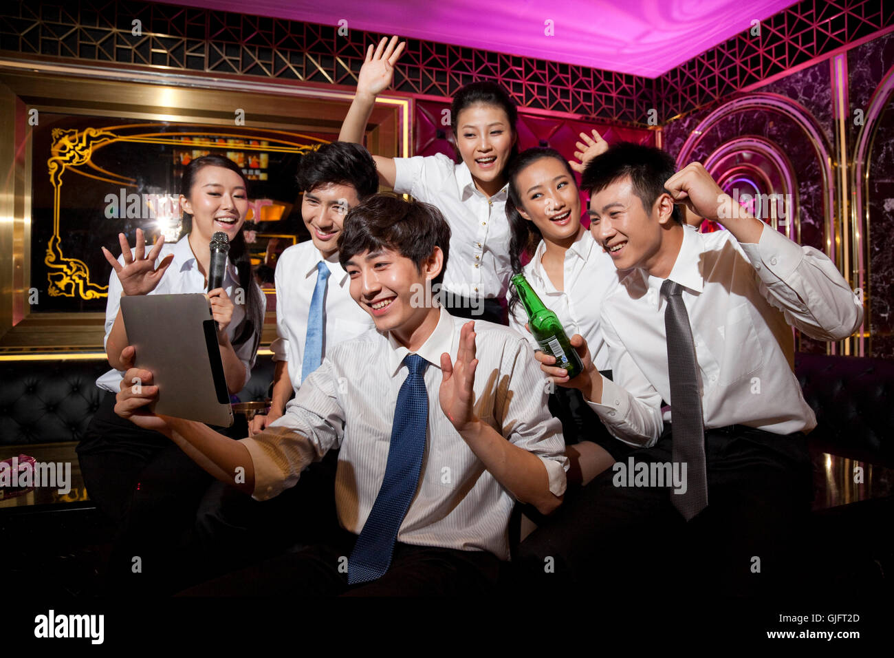 Young woman singing in KTV Stock Photo - Alamy