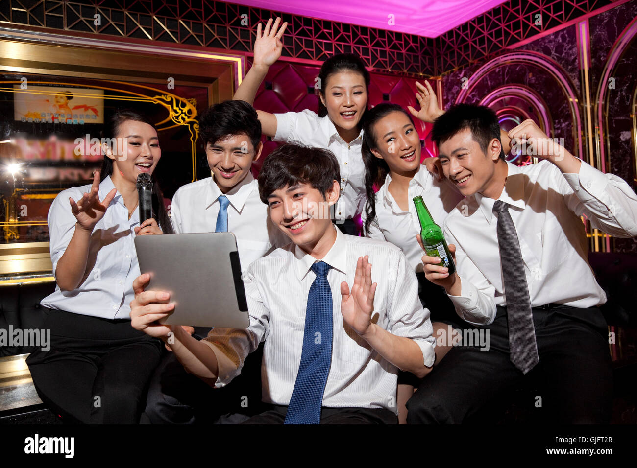 Young woman singing in KTV Stock Photo - Alamy