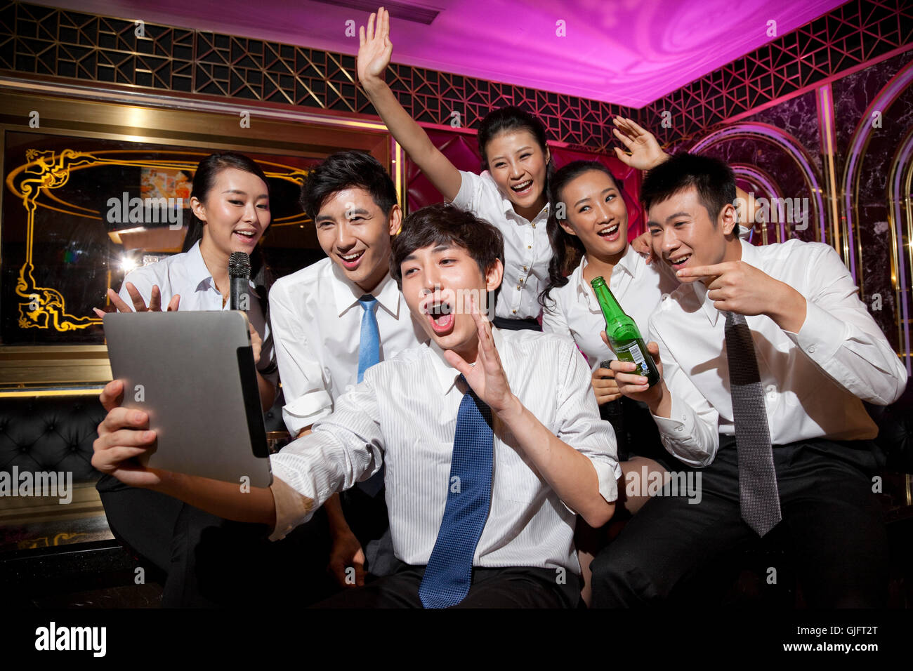Young woman singing in KTV Stock Photo - Alamy