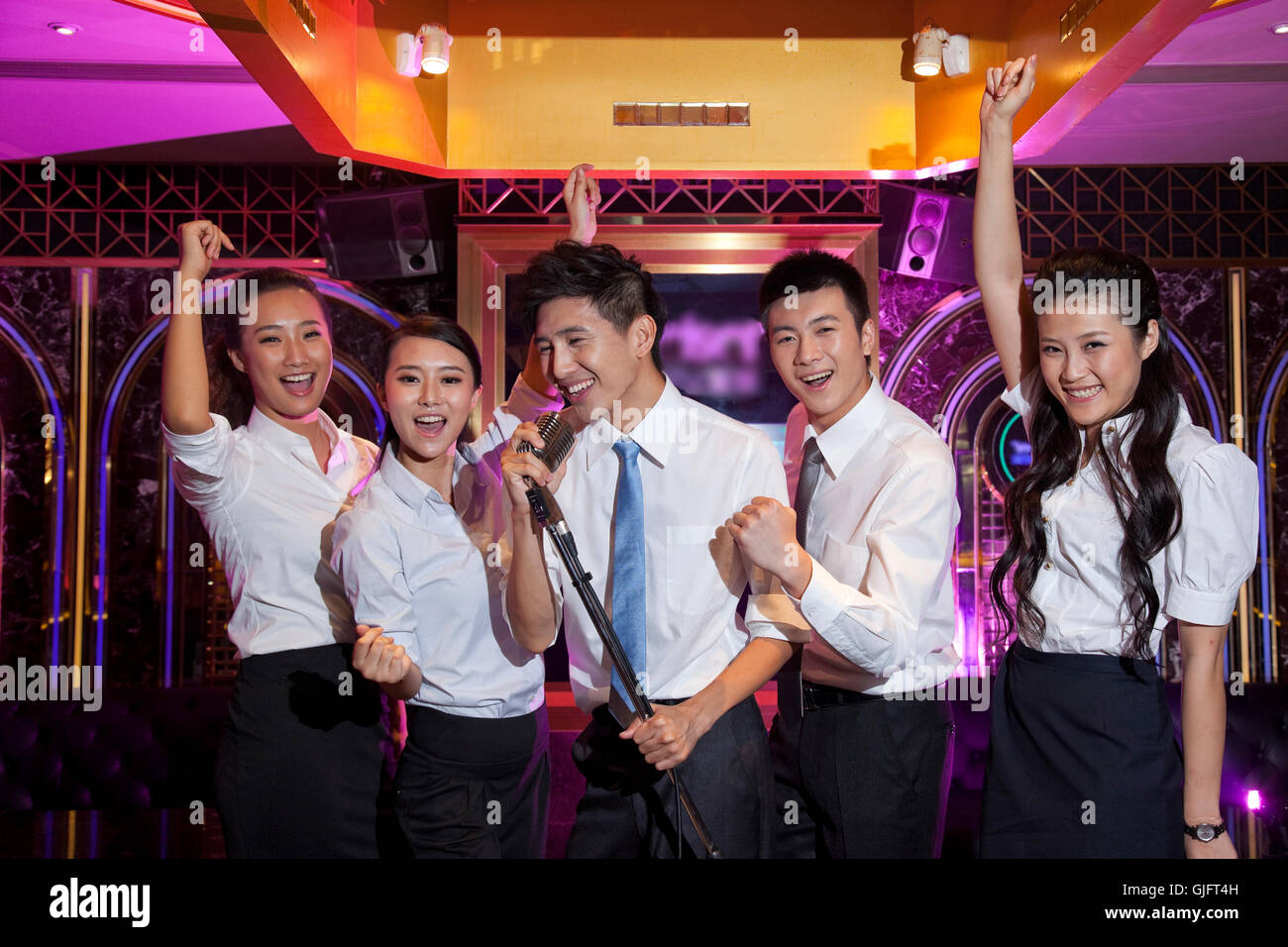Group of young people gathering in KTV Stock Photo - Alamy