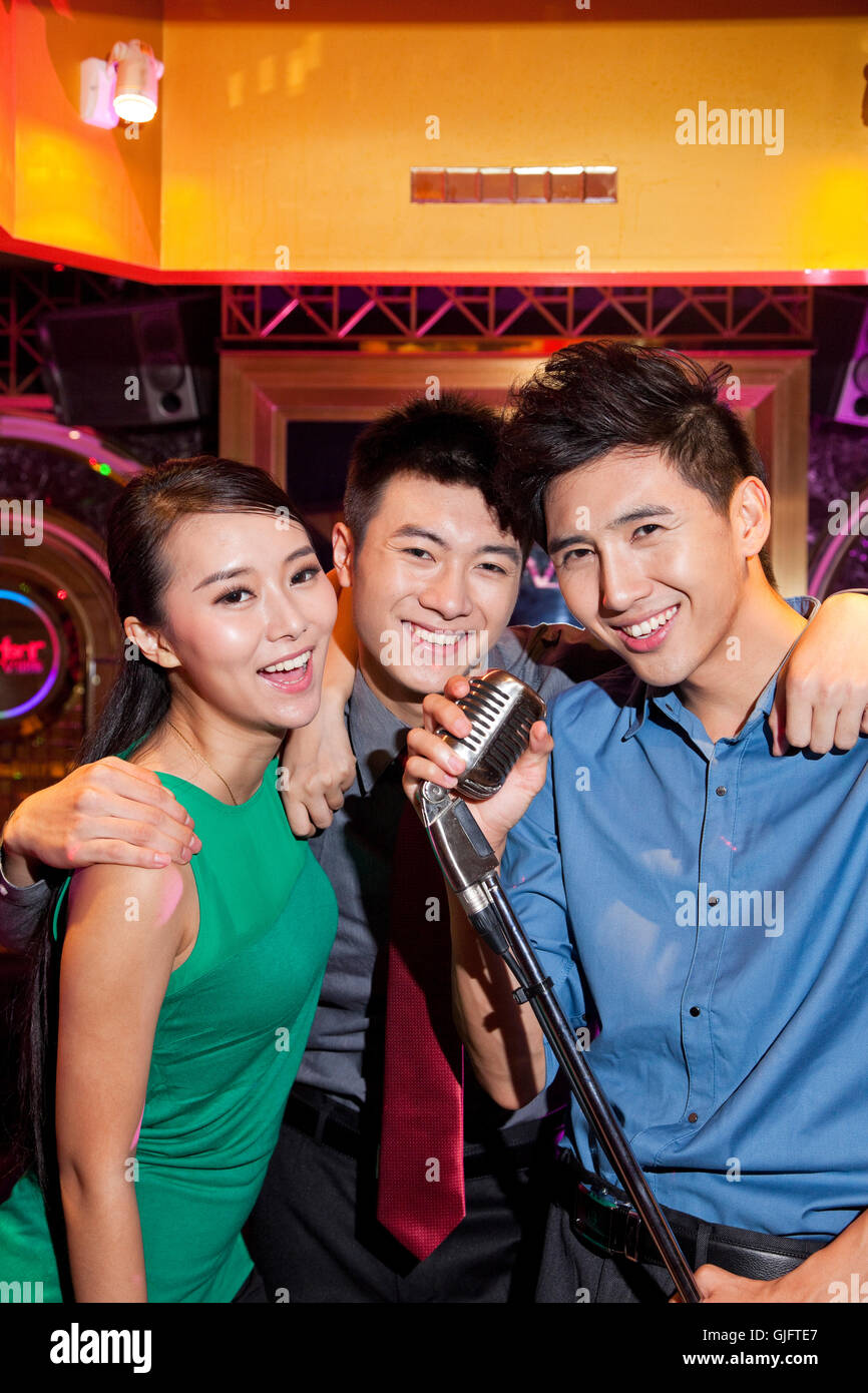 Group of young people gathering in KTV Stock Photo - Alamy