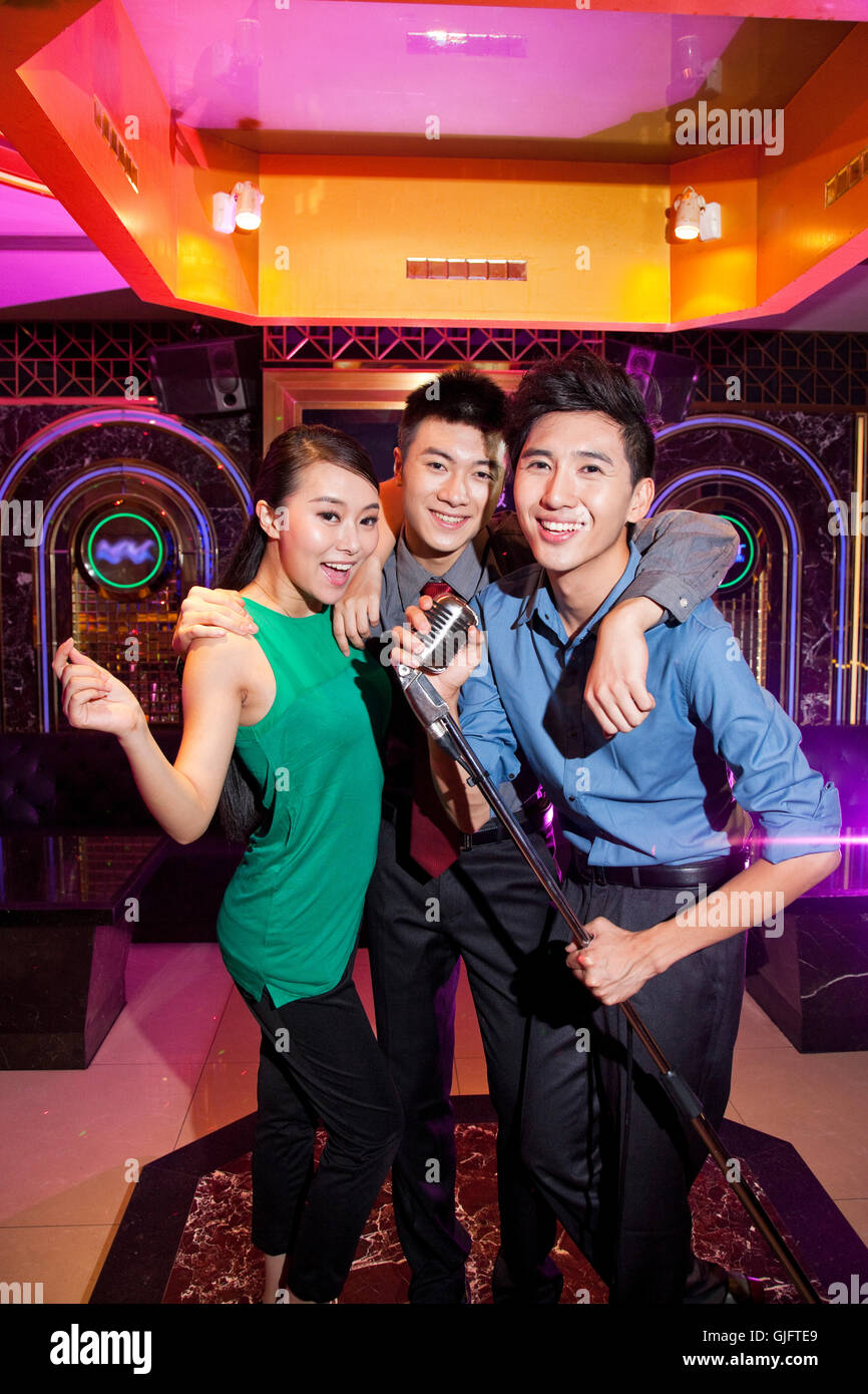 Group of young people gathering in KTV Stock Photo - Alamy