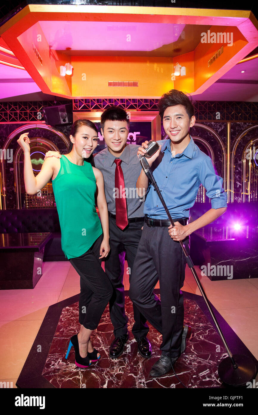 Group of young people gathering in KTV Stock Photo - Alamy