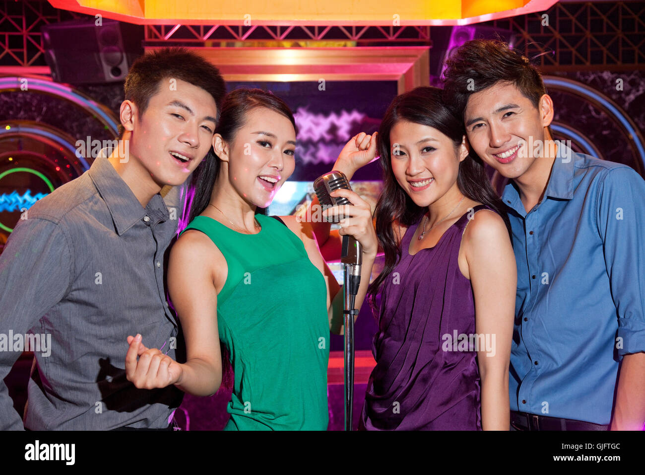 Group of young people gathering in KTV Stock Photo - Alamy