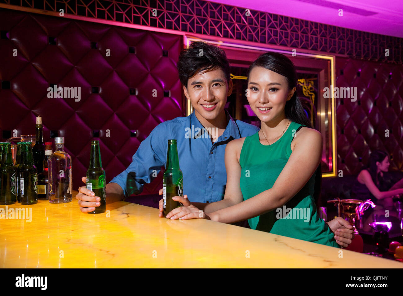 Young couple in KTV drink Stock Photo - Alamy