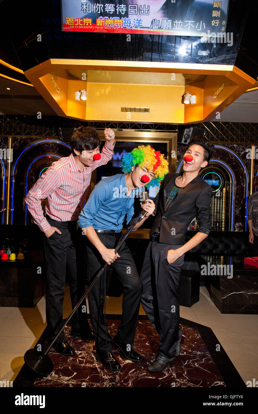 Group of young people gathering in KTV Stock Photo - Alamy
