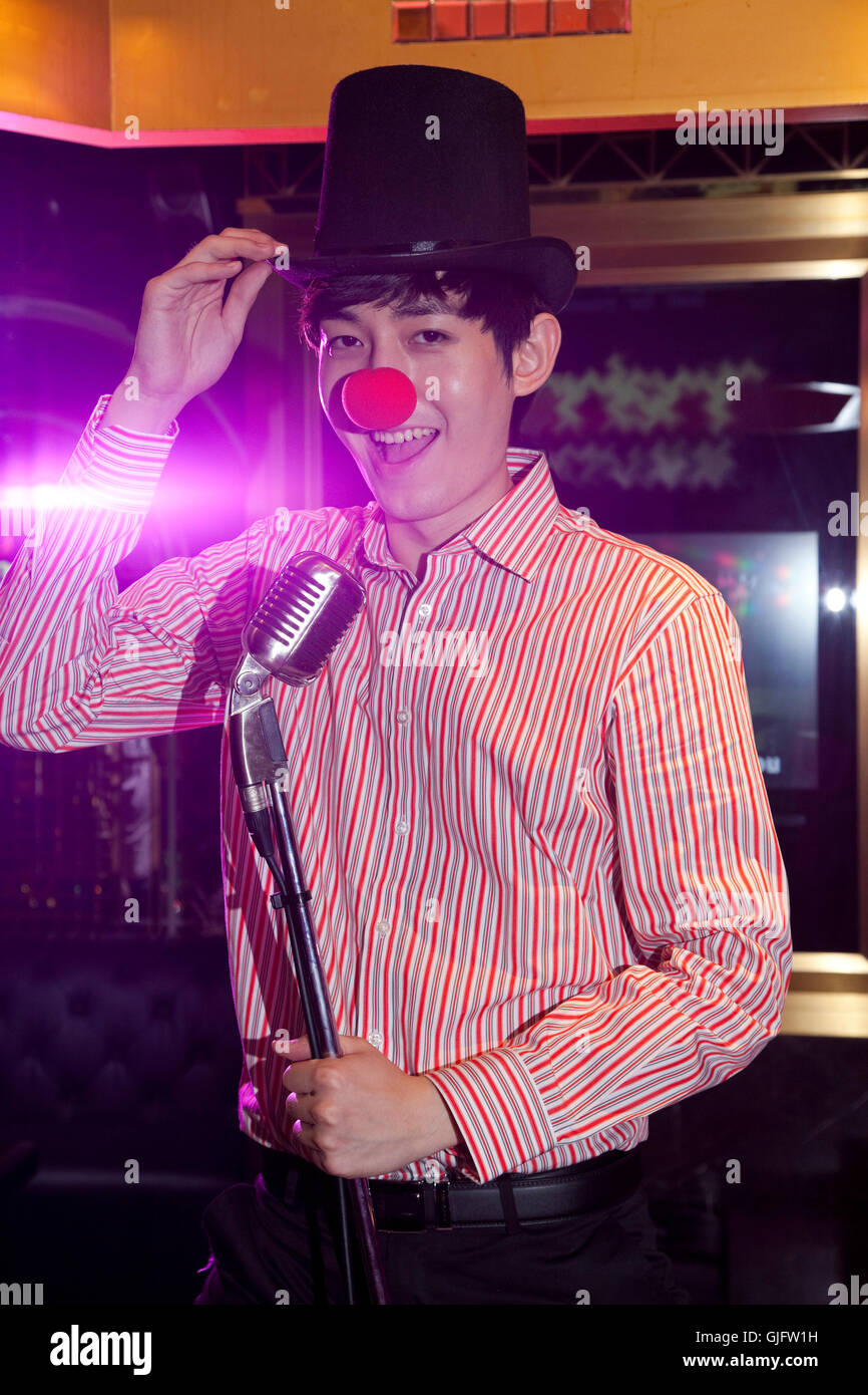 Young woman singing in KTV Stock Photo - Alamy