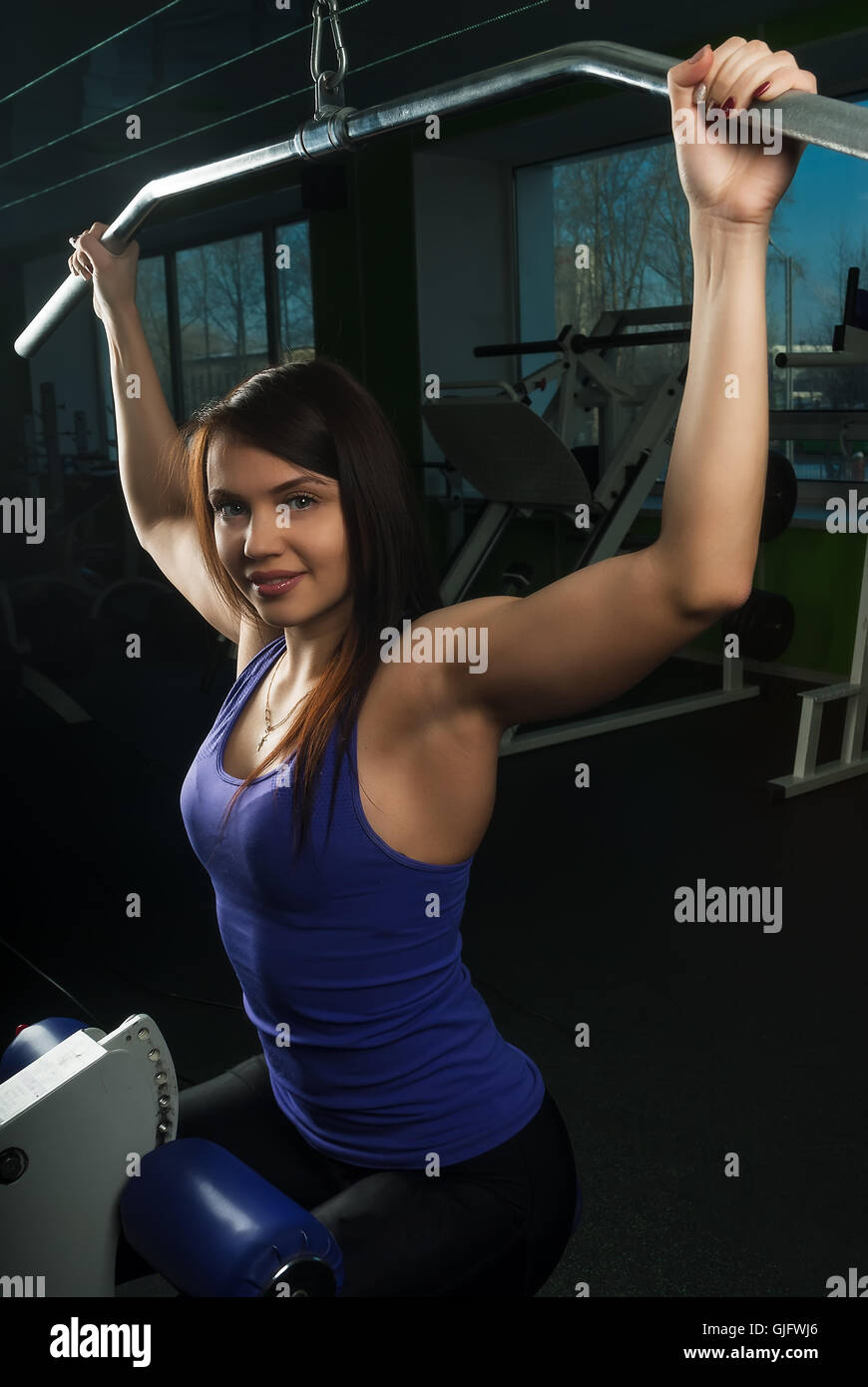 Beautiful muscular fit woman exercising Stock Photo - Alamy