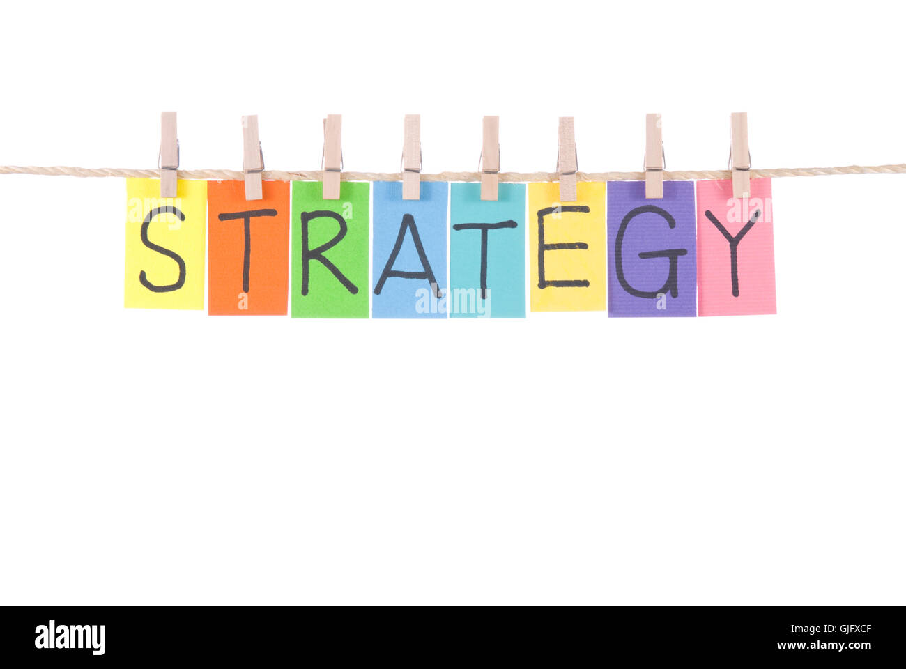 Strategy, words hang by wooden peg Stock Photo - Alamy