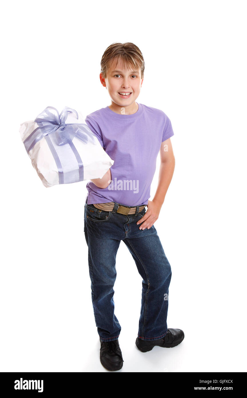 Young boy holding present Stock Photo - Alamy