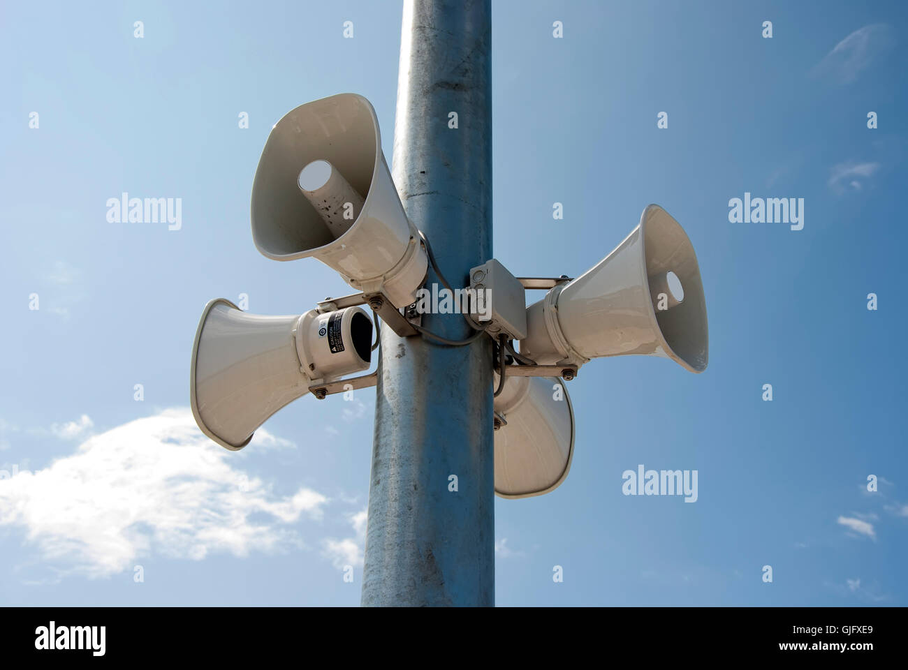 four megaphone hanging on a pole Stock Photo - Alamy