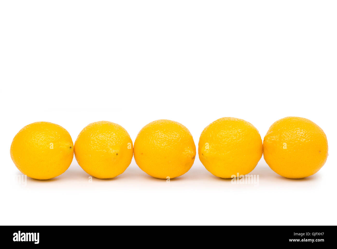 golden lemon in a row Stock Photo - Alamy