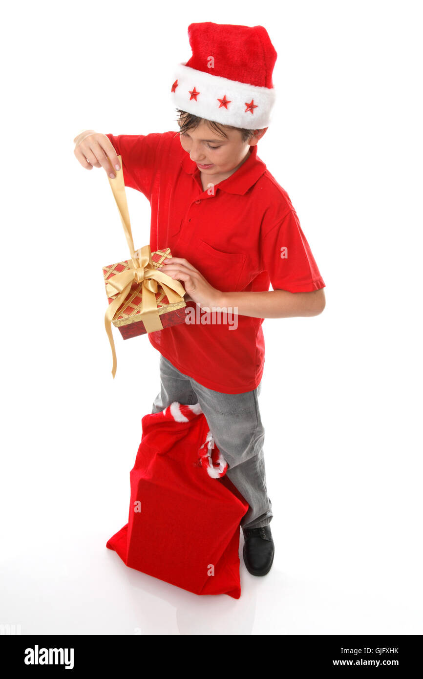 Boy opening Christmas present Stock Photo - Alamy