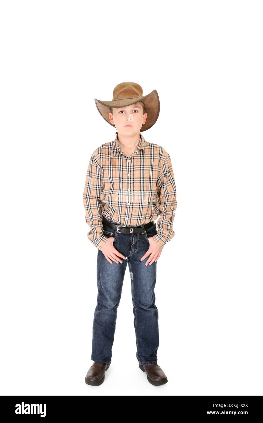 Young cowboy standing on white background Stock Photo - Alamy