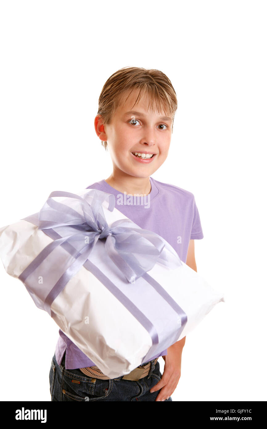A boy holding a wrapped present Stock Photo - Alamy