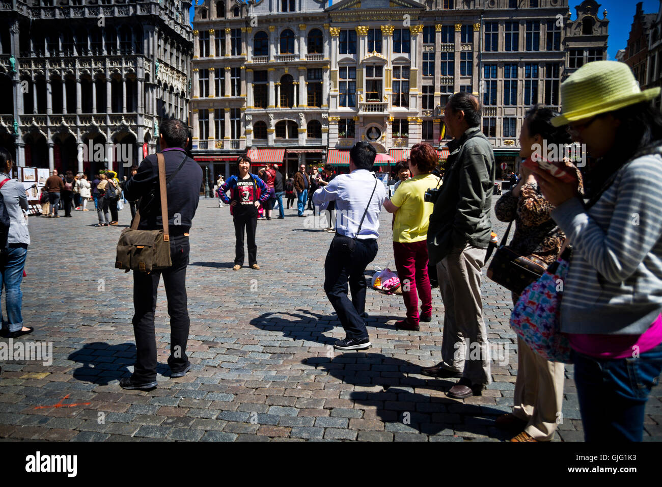 Tourists take photographs in the Grand Place, Brussels, Belgium Stock ...