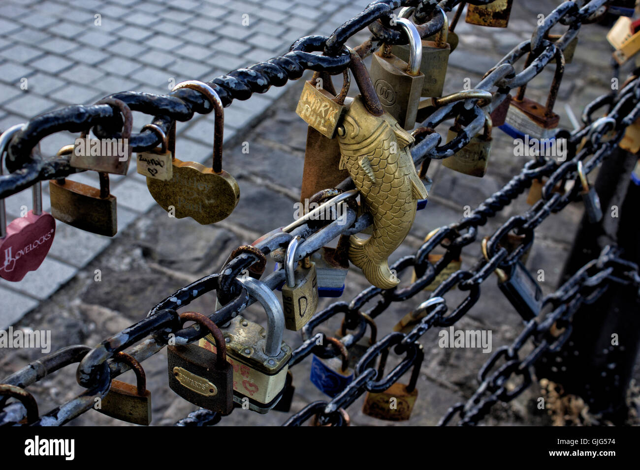 Padlocks on chains by the docks Stock Photo - Alamy