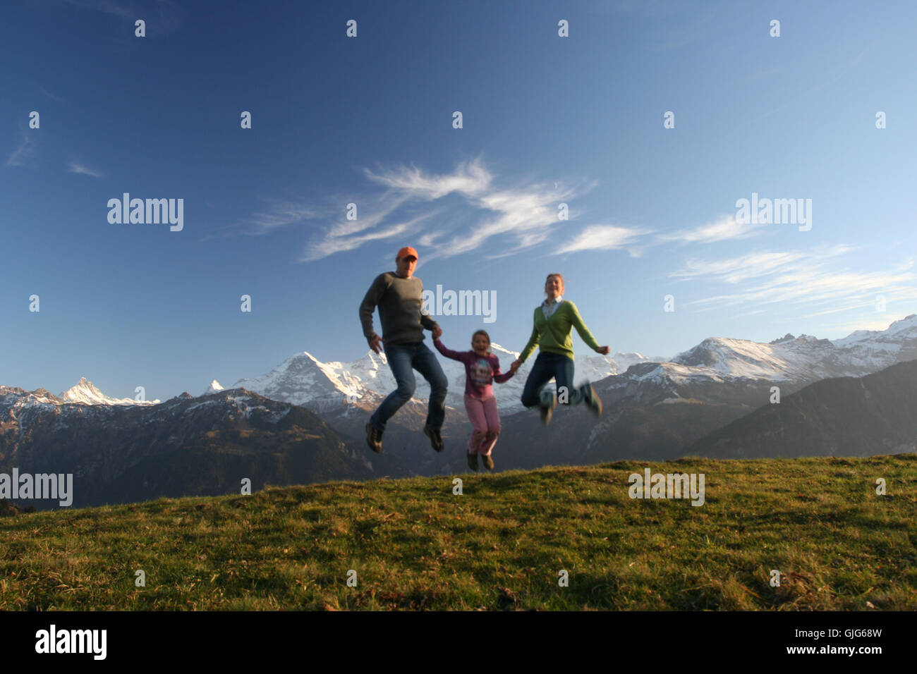 happy family jumping Stock Photo - Alamy