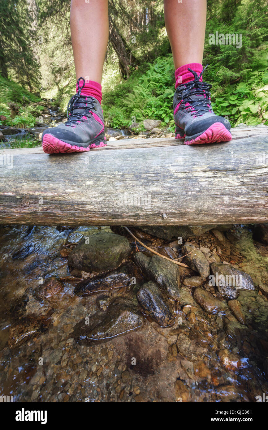 girl hiking boots on woof bridge Stock Photo - Alamy