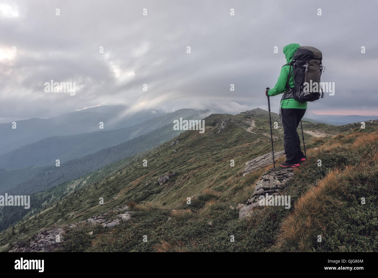 Tourist girl hiker top mountain hi-res stock photography and images - Alamy