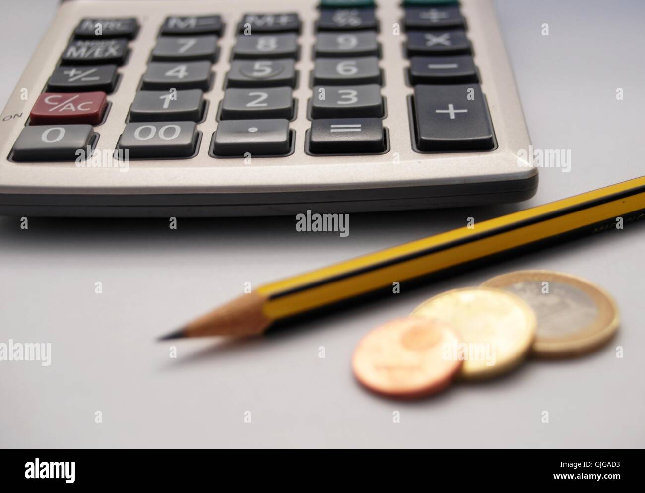 Pencil on calculator hi-res stock photography and images - Alamy