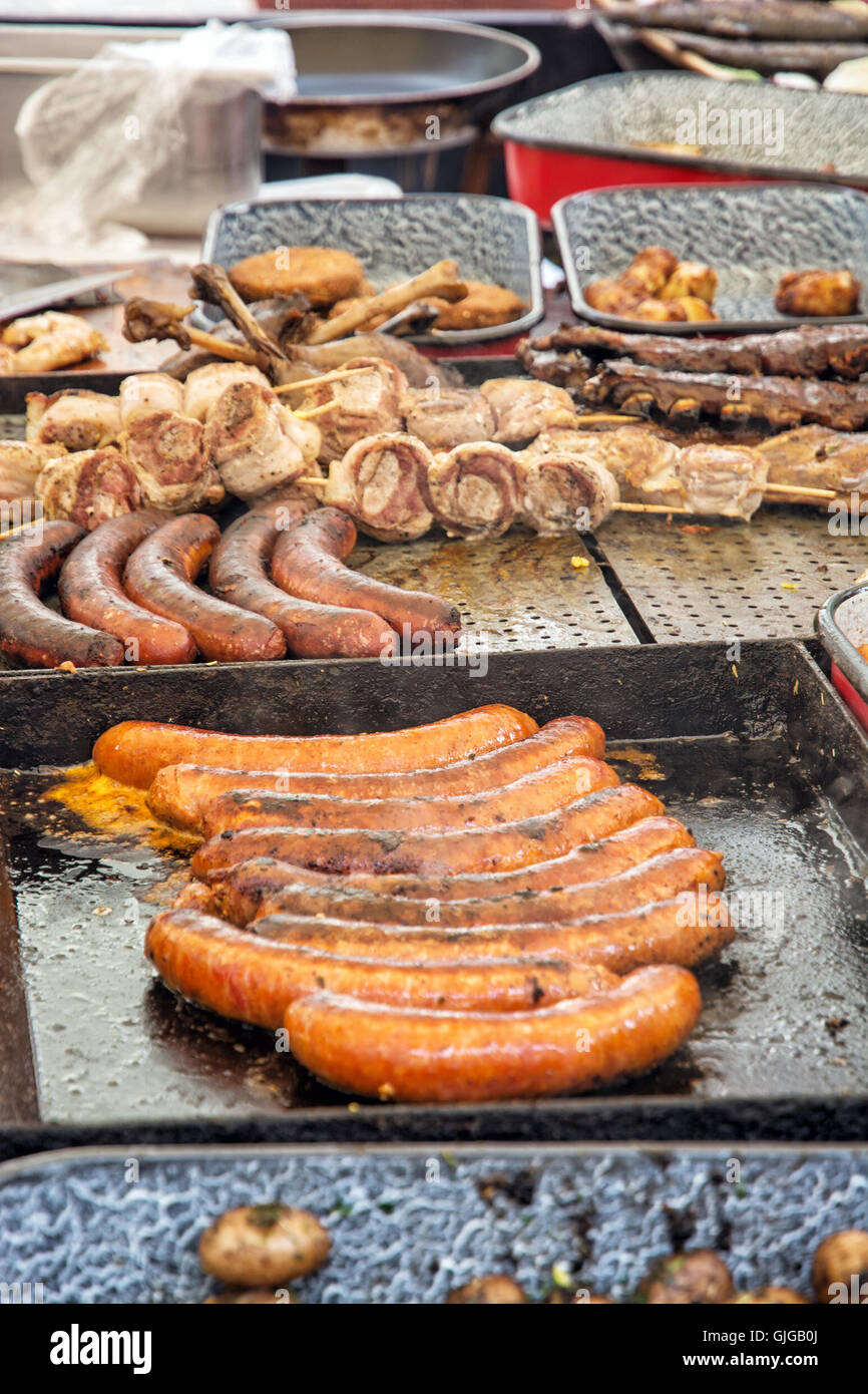 Barbecue scene. Meat collection on the grill. Garden restaurant ...