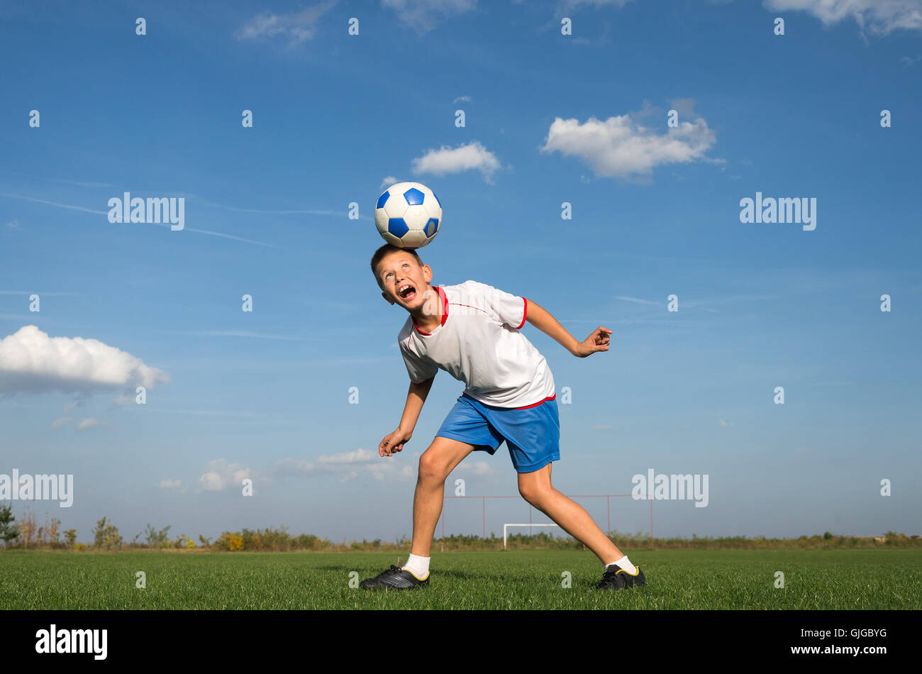 Kids playing football head hi-res stock photography and images - Alamy