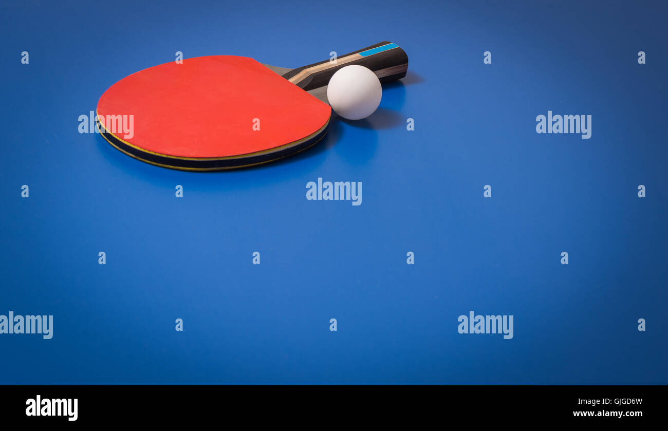 Tabletennis racket and ball on table Stock Photo - Alamy