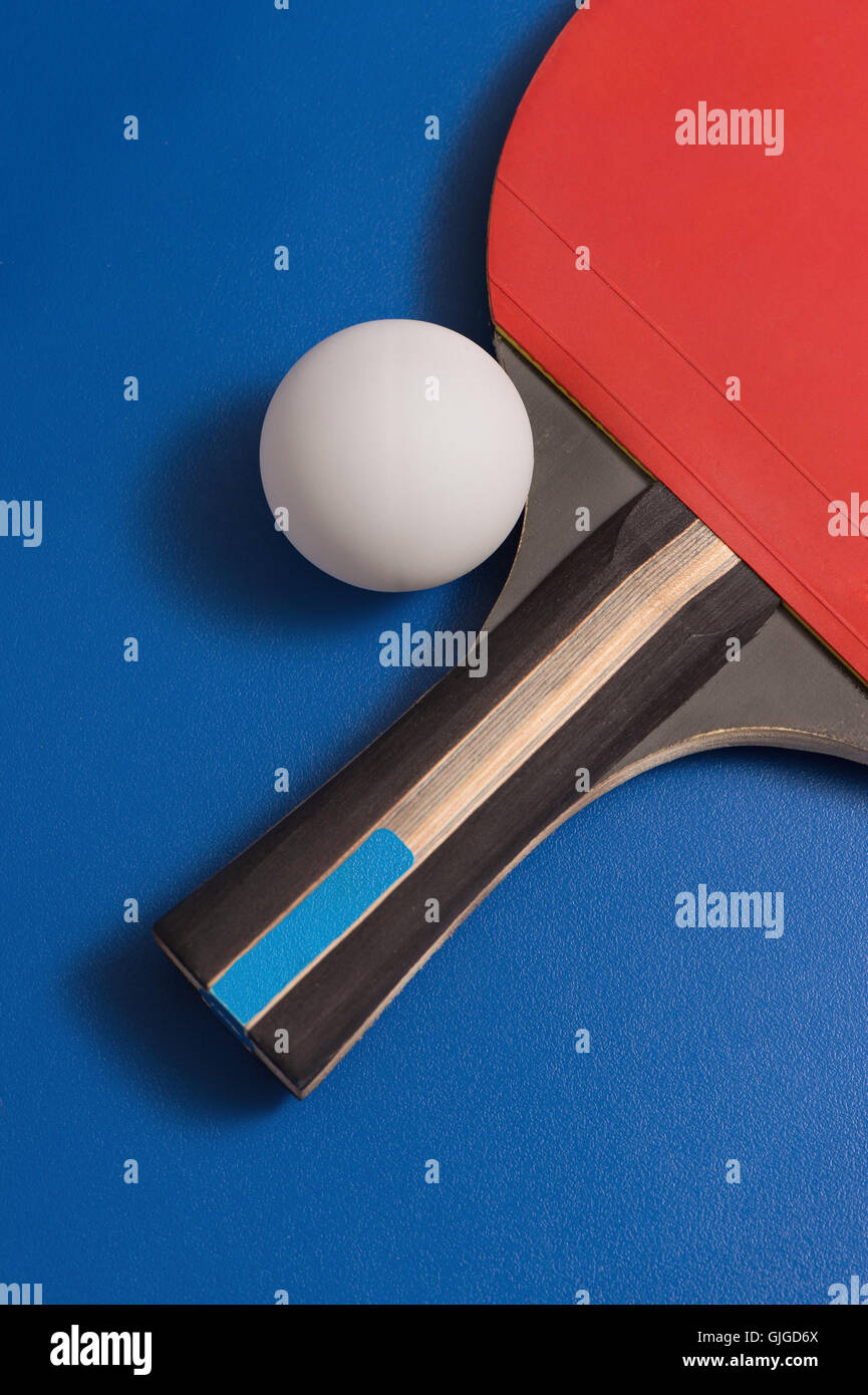 Tabletennis racket and ball on table Stock Photo - Alamy