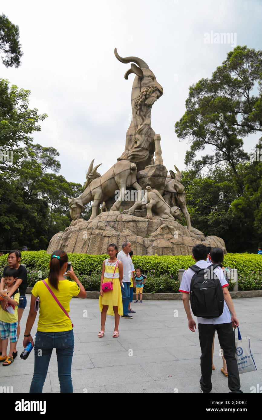 Locals and tourists are taking photos with the granite Statue of Five ...
