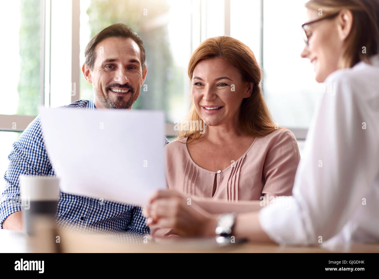 Cheerful colleagues sharing ideas Stock Photo - Alamy