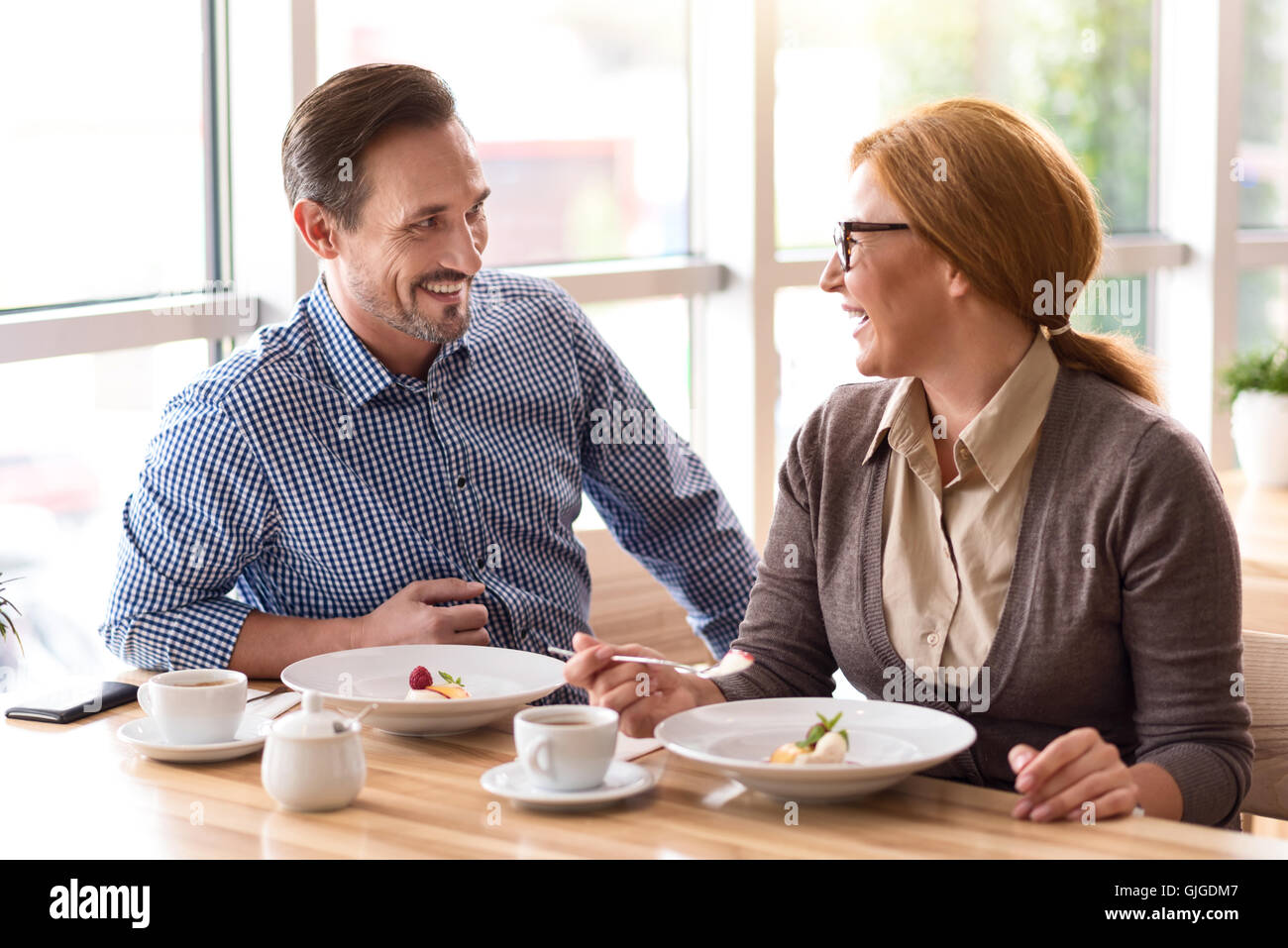 Positive colleagues having a lunch Stock Photo - Alamy