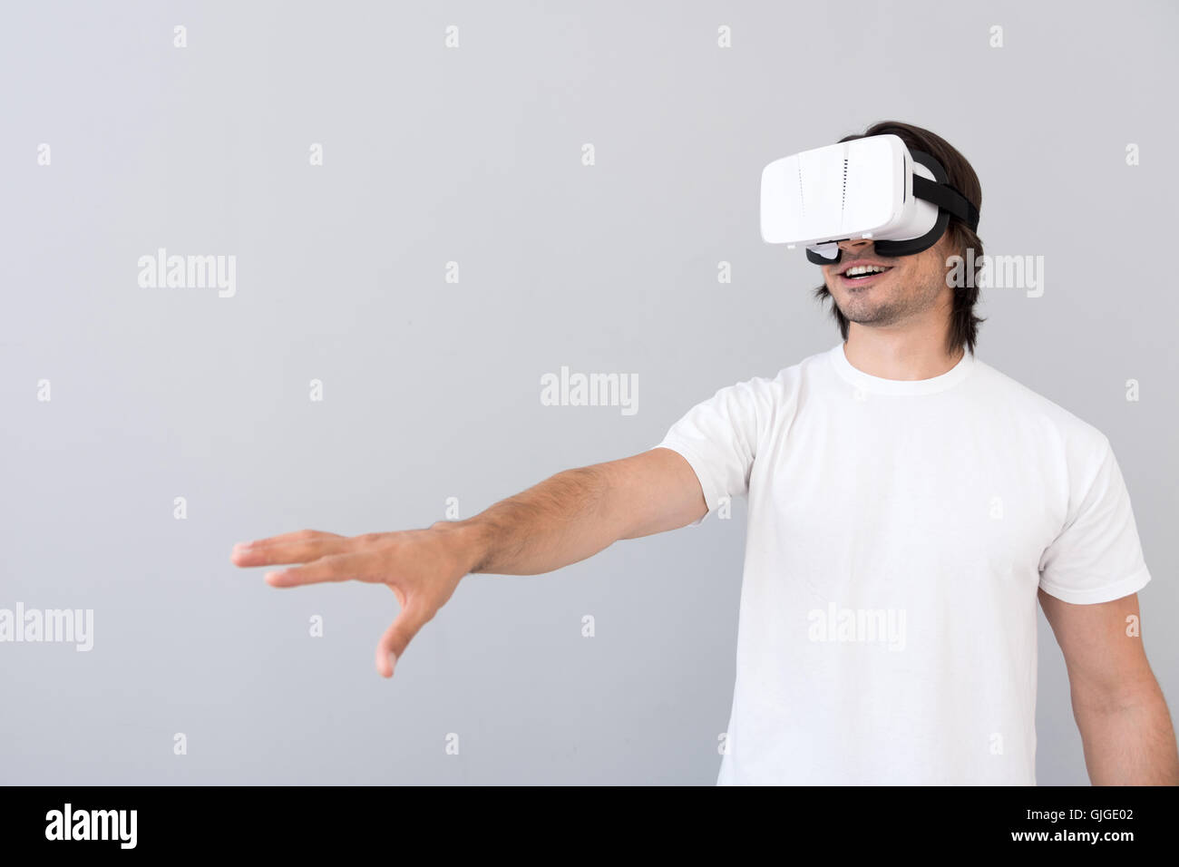 Young handsome man using virtual hi-res stock photography and images ...