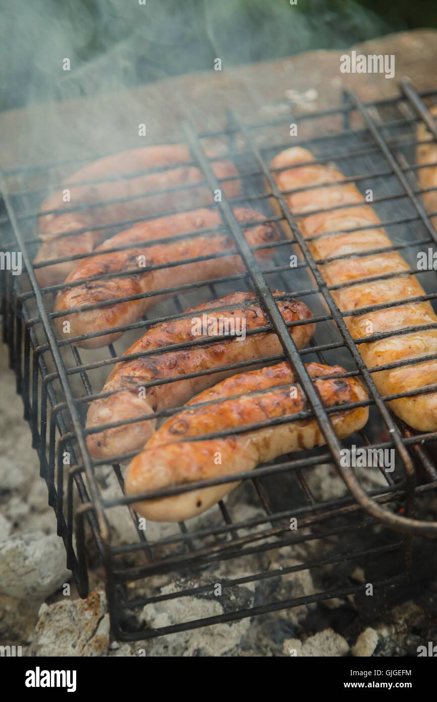 Sausages on grill Stock Photo - Alamy