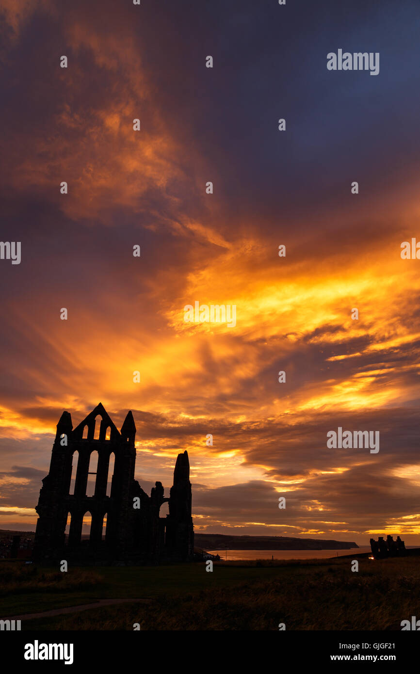 Whitby Abbey against a dramatic sunset. In Whitby, North Yorkshire ...