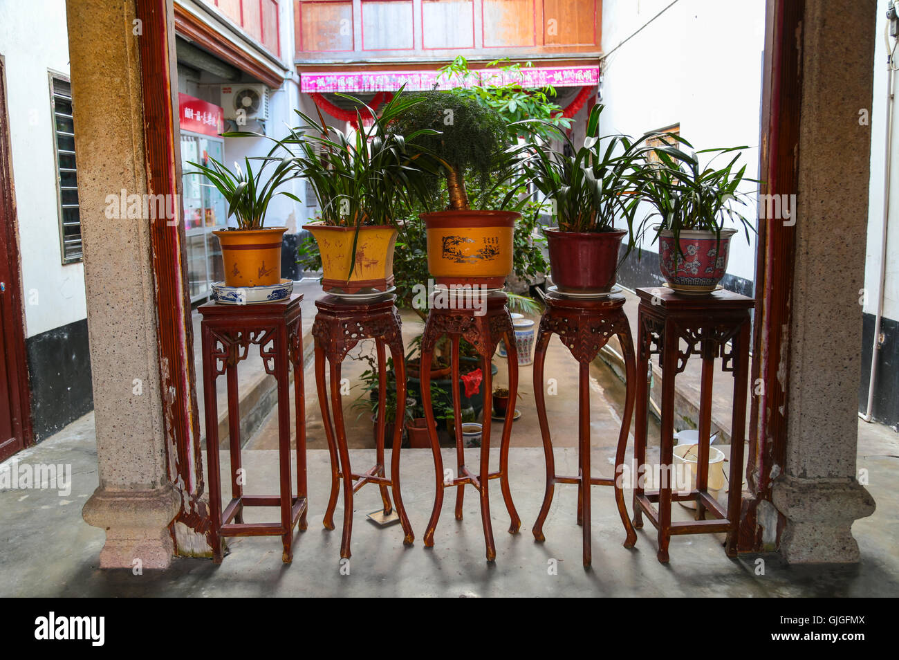 Flower vase and chinese classic stools in Hakka round house restaurant ...