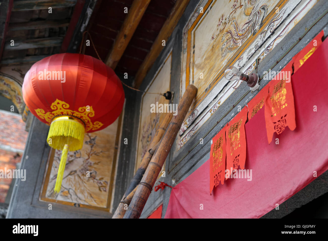 An ancient chinese doorway of a Hakka round house restaurant at Meizhou ...