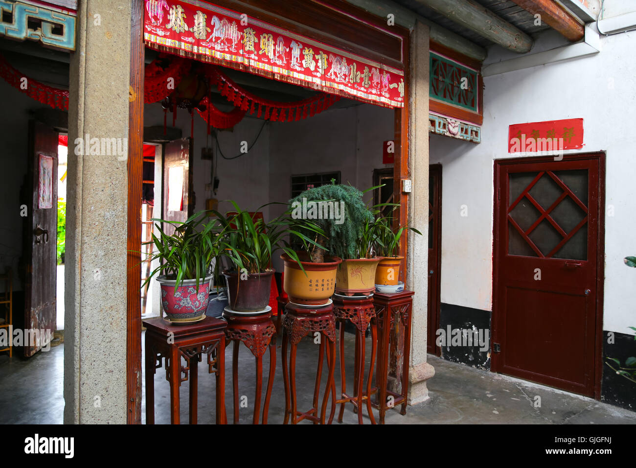 Flower vase and chinese classic stools in Hakka round house restaurant ...