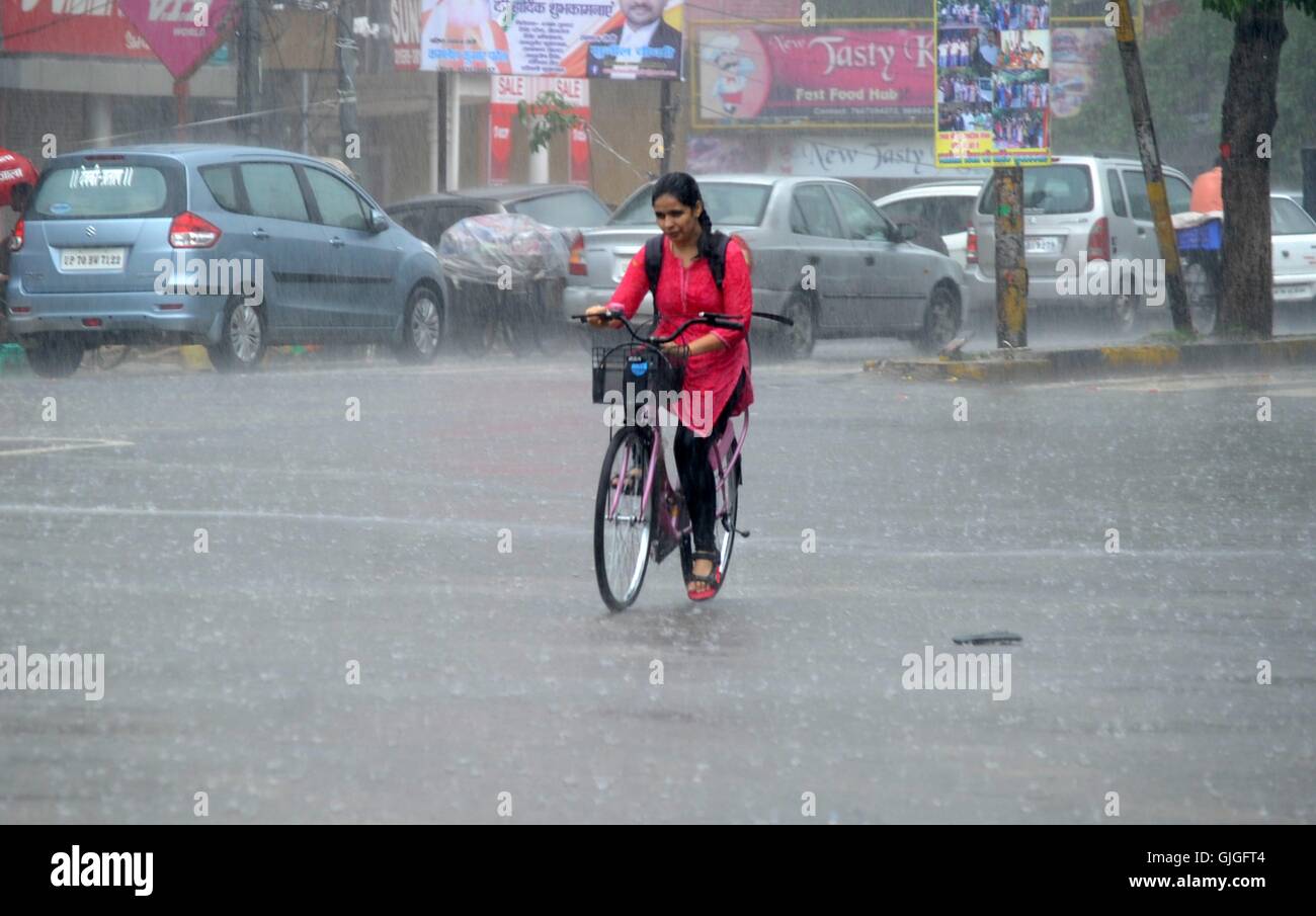 Allahabad, India. 16th Aug, 2016. A girl paddle her bicycle during ...