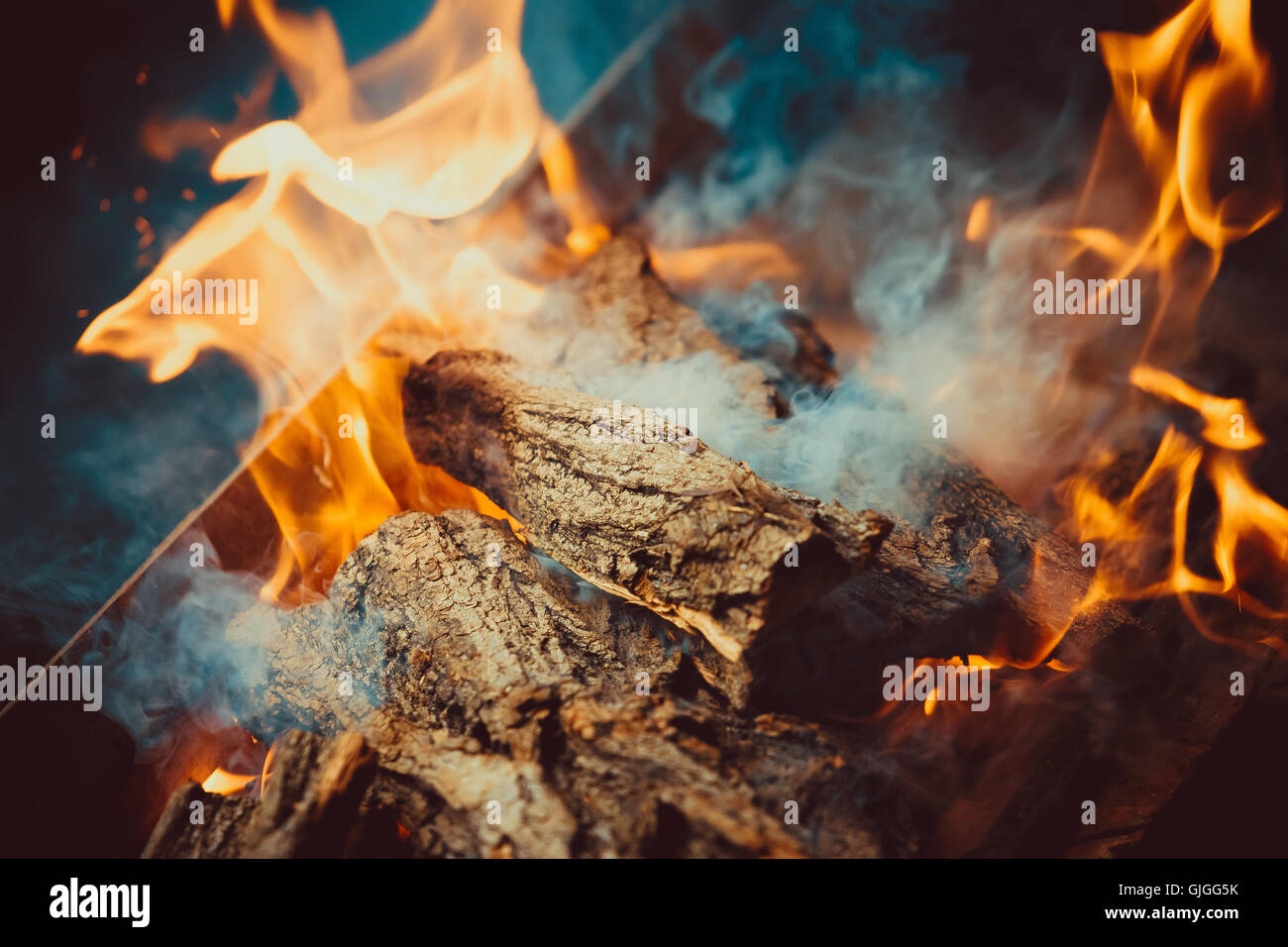 Beautiful burning fire flame background with smoke Stock Photo - Alamy