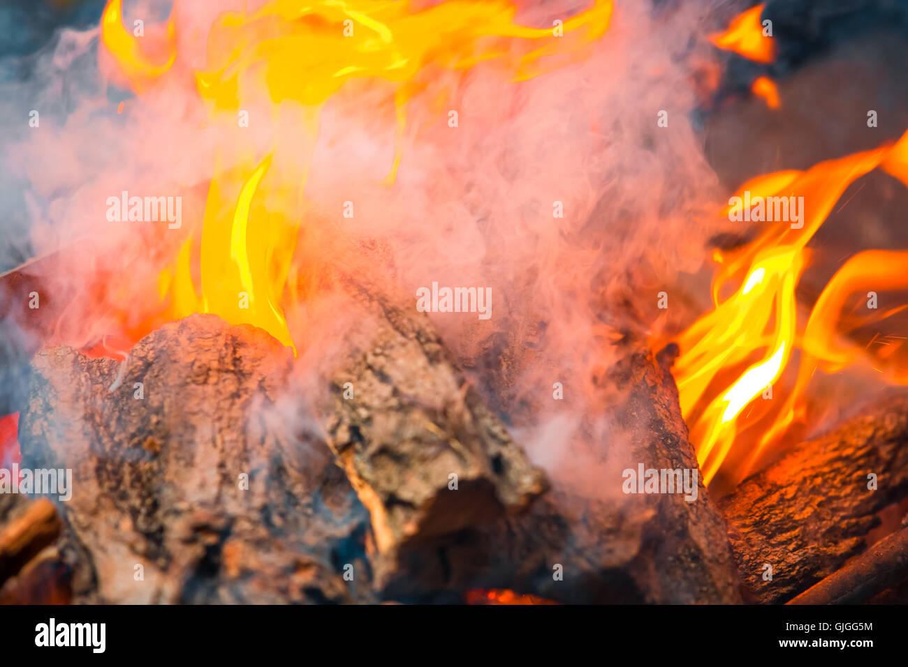 Beautiful burning fire flame background with smoke Stock Photo - Alamy