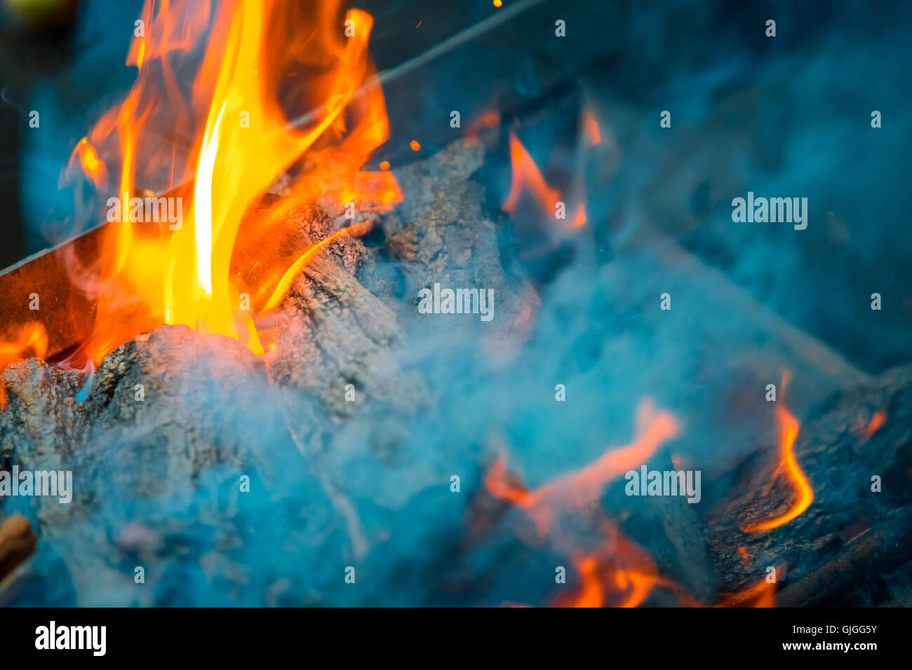 Beautiful burning fire flame background with smoke Stock Photo - Alamy