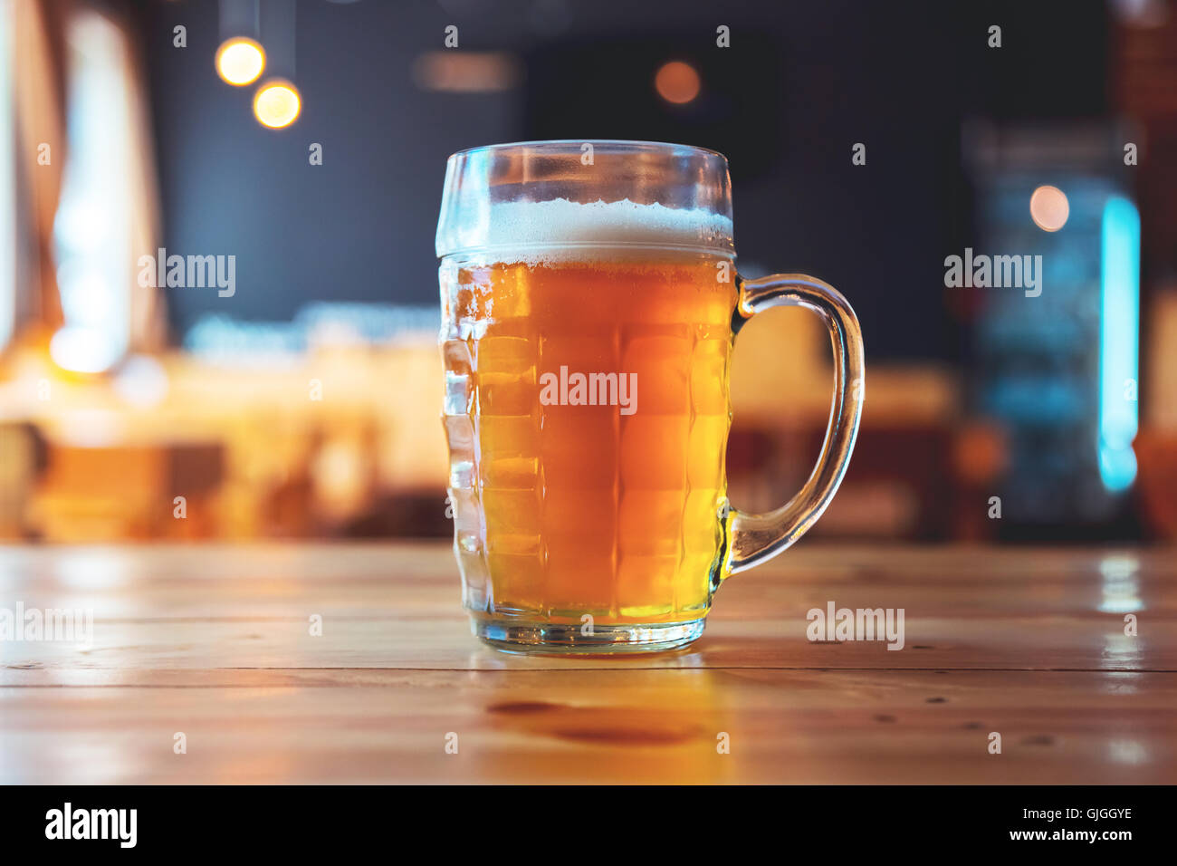Beautiful background of the Oktoberfest. Glass of cold fresh lager beer ...