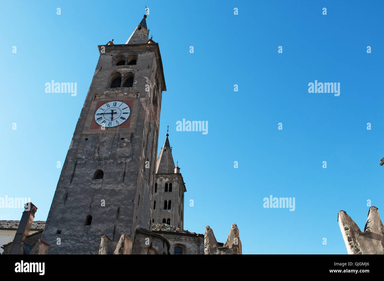 Aosta, Italy: the Romanesque clock tower of the Aosta Cathedral, one of ...
