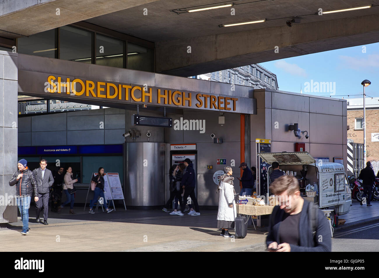 Busy station entrance with people. Shoreditch High Street Station ...