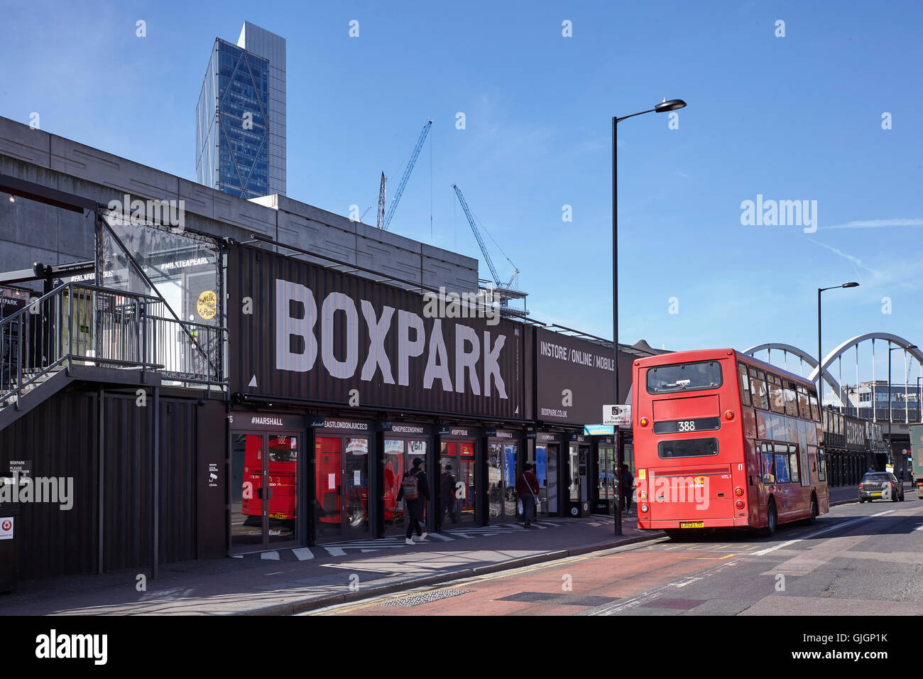 Boxpark retail spaces in shipping containers alongside the station with ...
